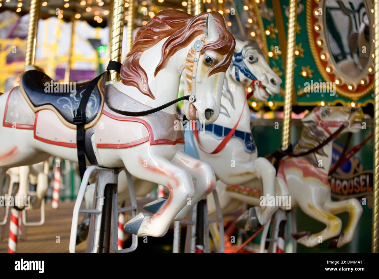 Roundabout with galloping horses hi-res stock photography and images ...