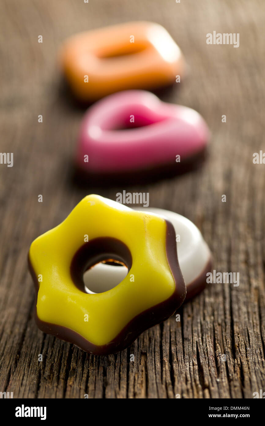 colorful confectionery on wooden background Stock Photo - Alamy