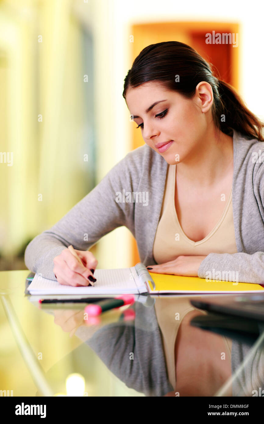 Young lady writing note hi-res stock photography and images - Alamy