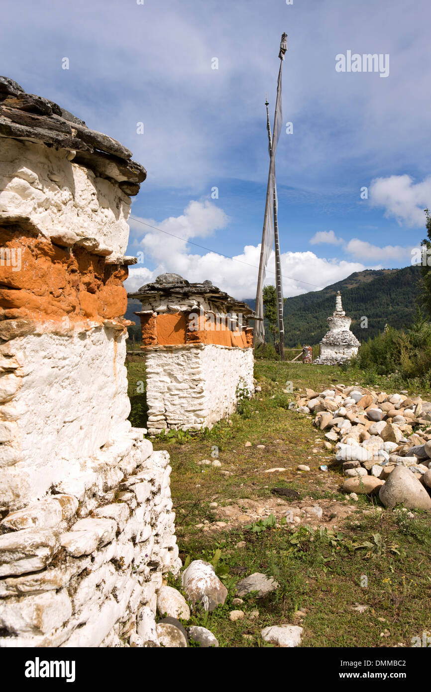 Bhutan, Bumthang Valley, Jambey old coarsely painted mani wall and ...