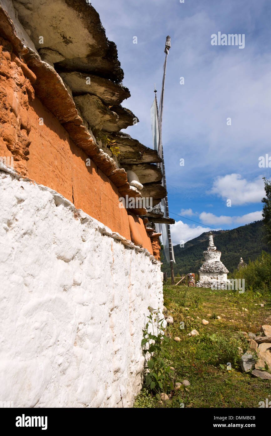 Bhutan, Bumthang Valley, Jambey old coarsely painted mani wall and ...