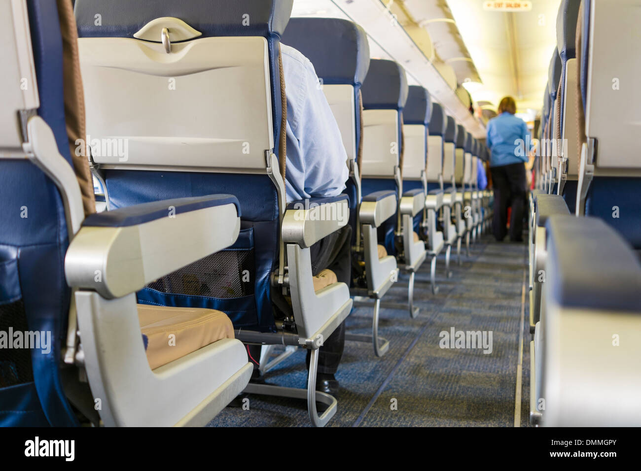 Commercial airplane interior with seats and aisle Stock Photo - Alamy