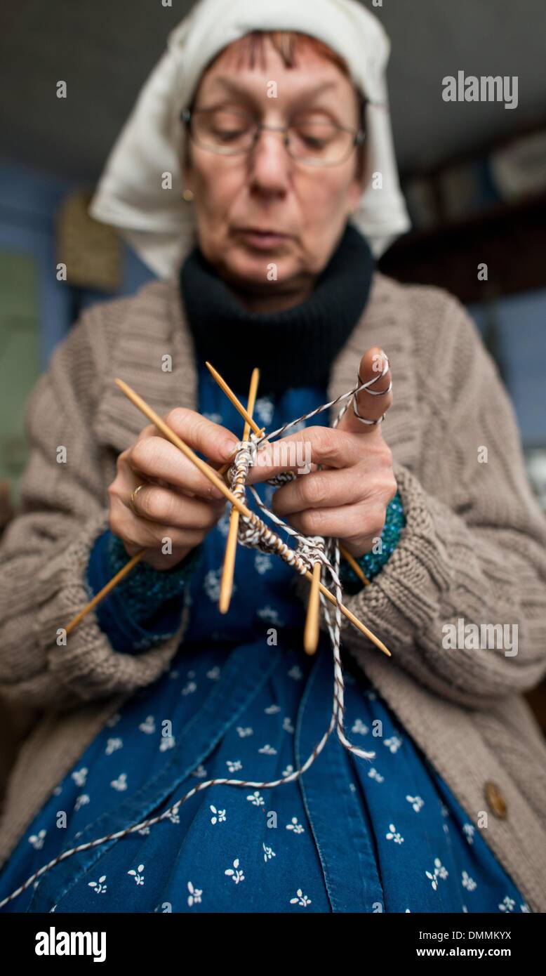 Lehde, Germany. 8th Dec, 2013. A woman in traditional clothing from the ...
