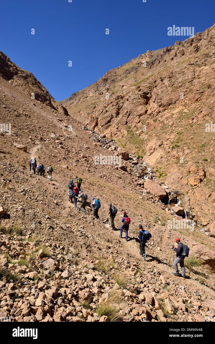 Iran, group of people hiking in Khoram Dasht valley, Alam Kuh area ...