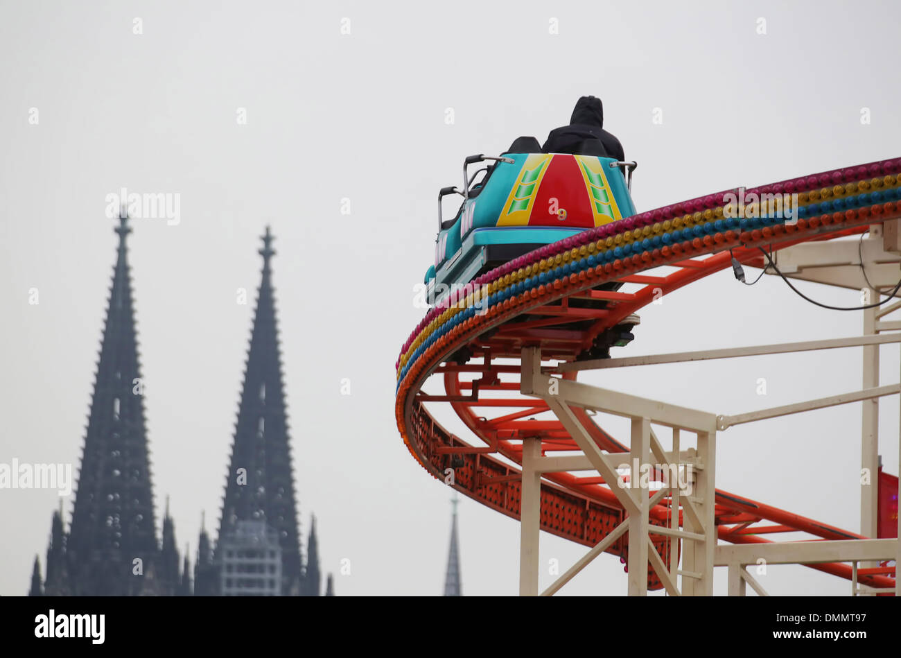 Germany, North Rhine-Westphalia, Cologne, Roller coaster at fairground ...