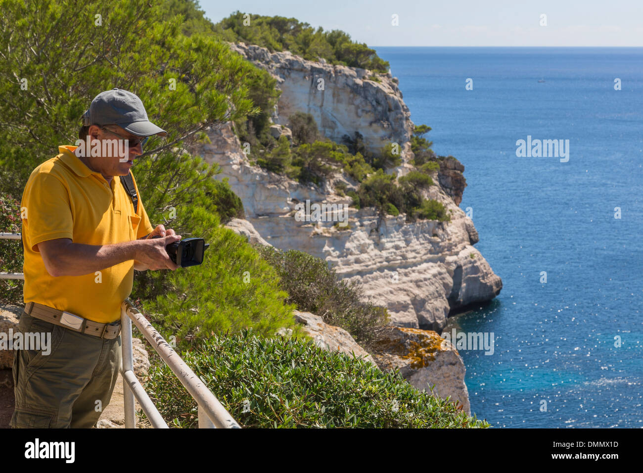 Man filming at cala galdana hi-res stock photography and images - Alamy