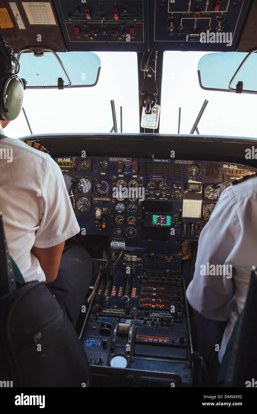 Two pilots in the cockpit of a Dornier 228 Stock Photo - Alamy