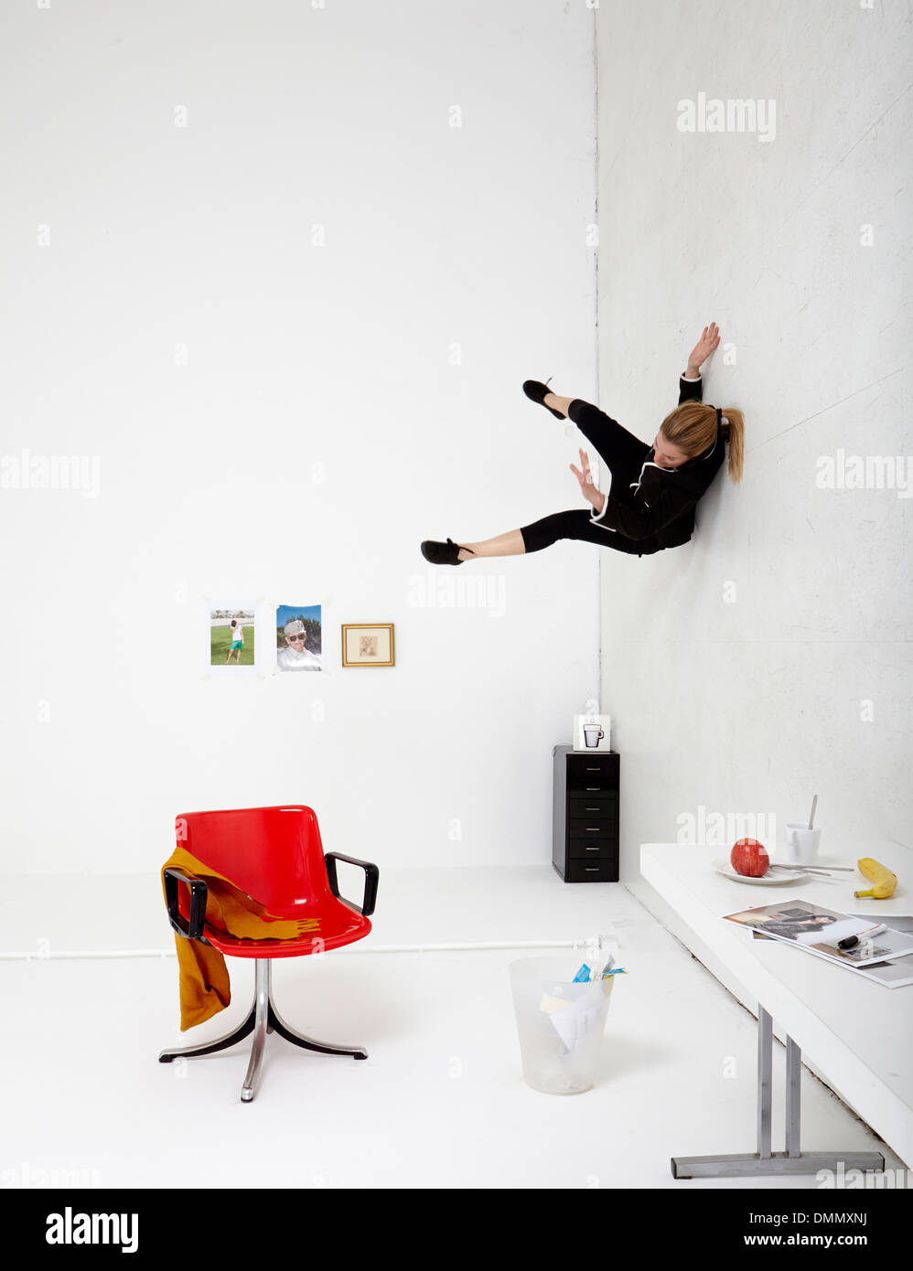Woman sliding on wall Stock Photo - Alamy