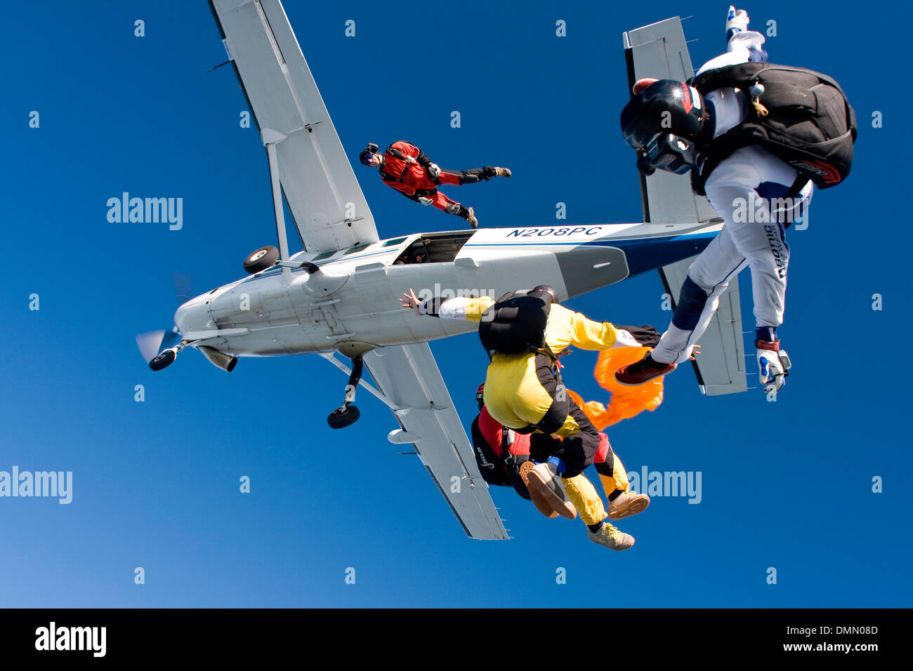 Freefly skydiving team is jumped out from an aircraft and making ...