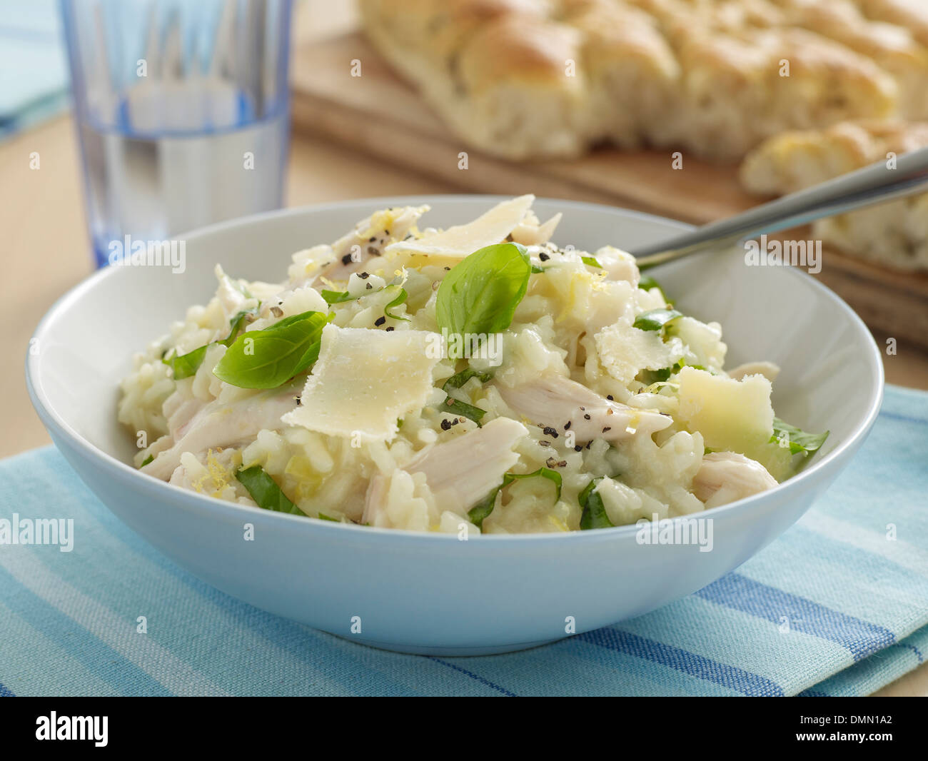 chicken risotto with basil and parmesan cheese slices Stock Photo - Alamy