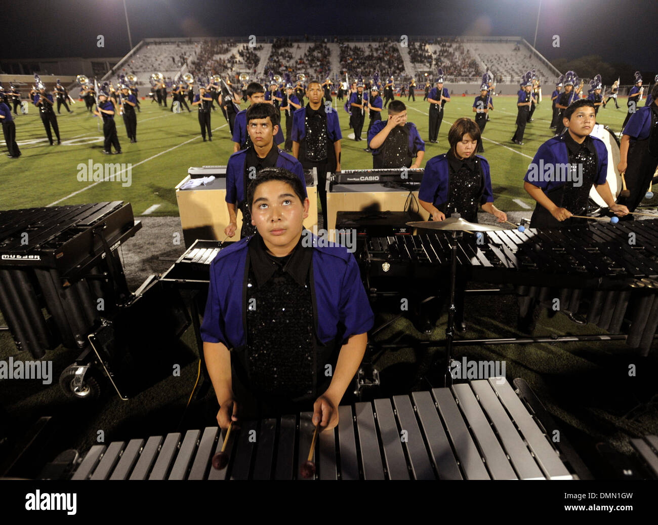 Members of the Warren High School percussion section watch their drum ...