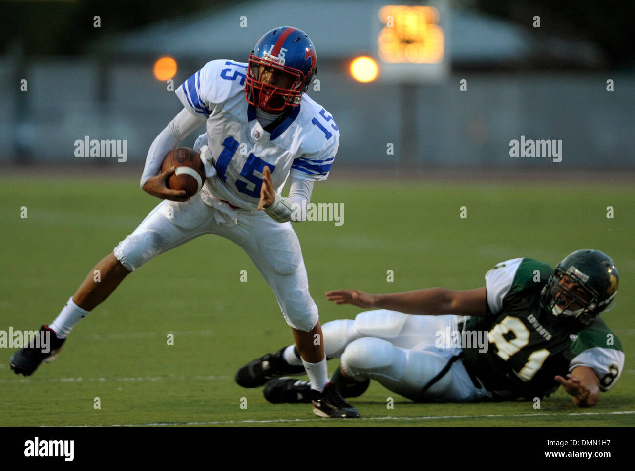 Jefferson quarterback Samuel Barron looks for daylight during boys prep ...