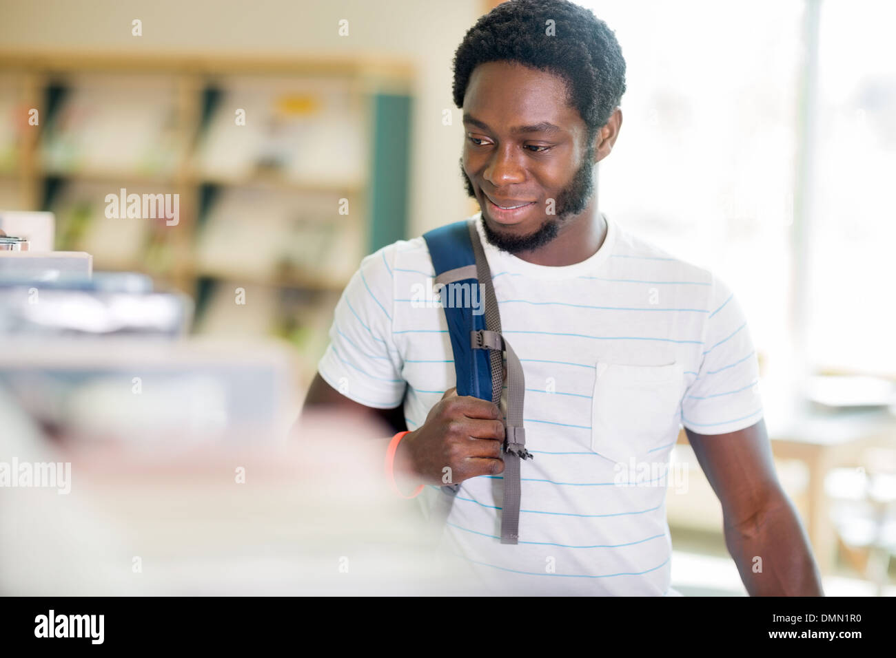 Young student looking books hi-res stock photography and images - Alamy