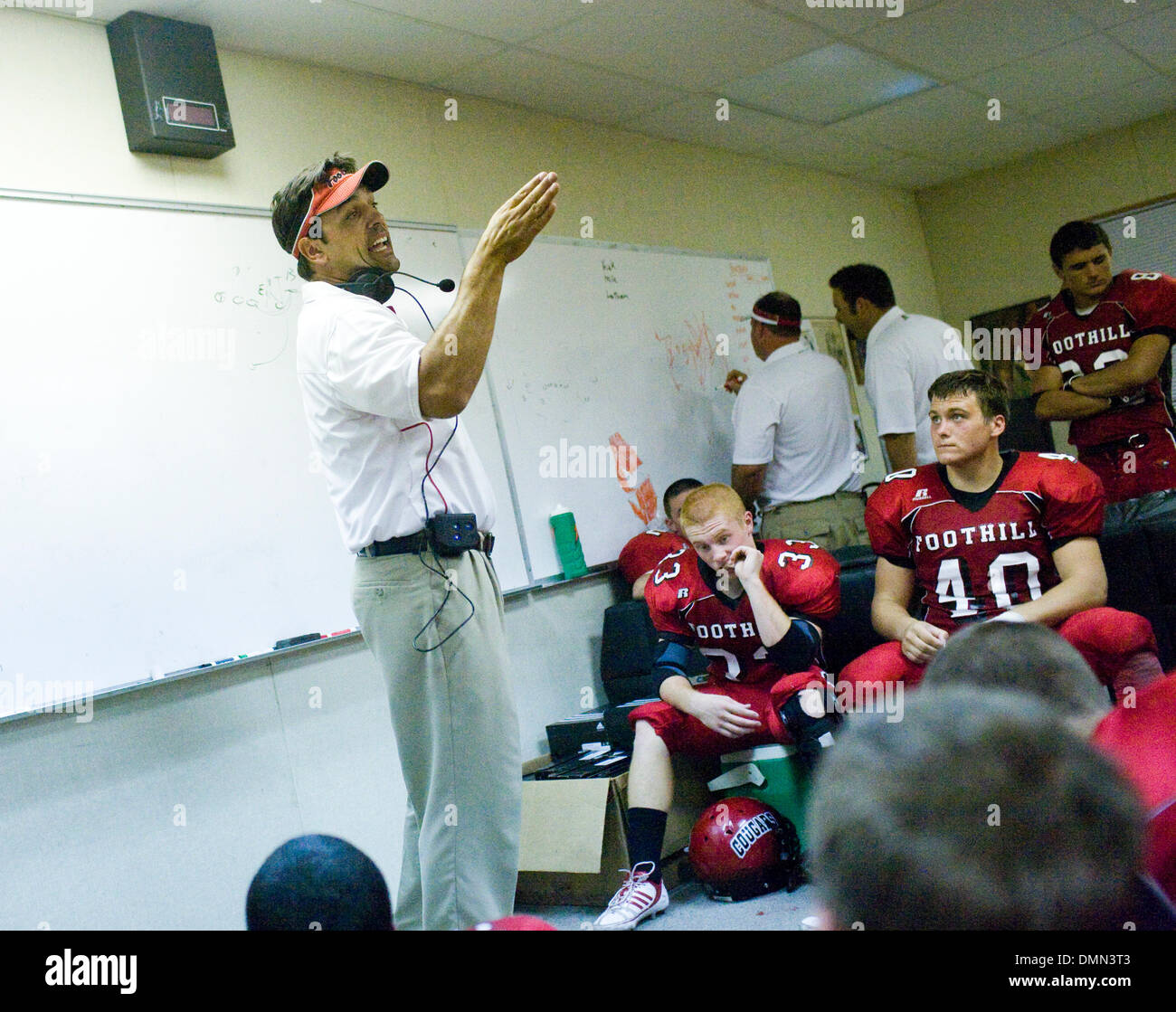 Coach Bryon Hamilton goes over second half during half time in the ...