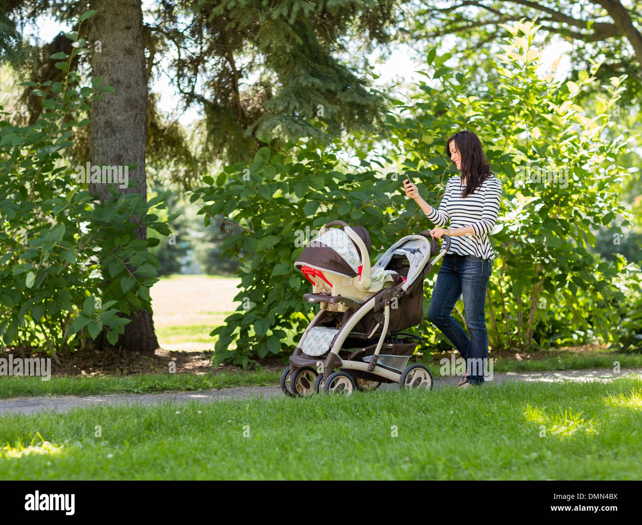 Pushing stroller mobile phone hi-res stock photography and images - Alamy