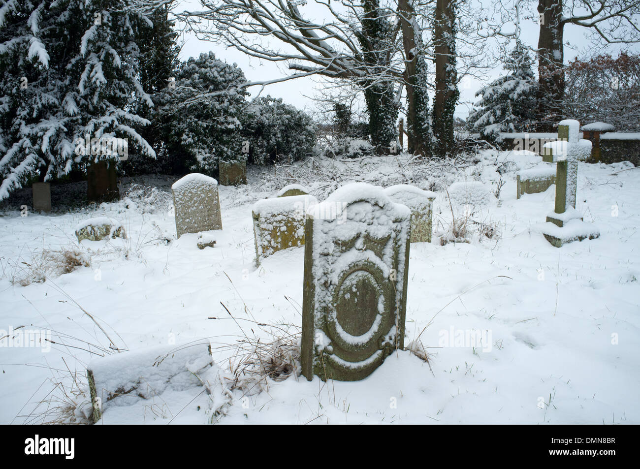Snow covered graveyard Stock Photo - Alamy