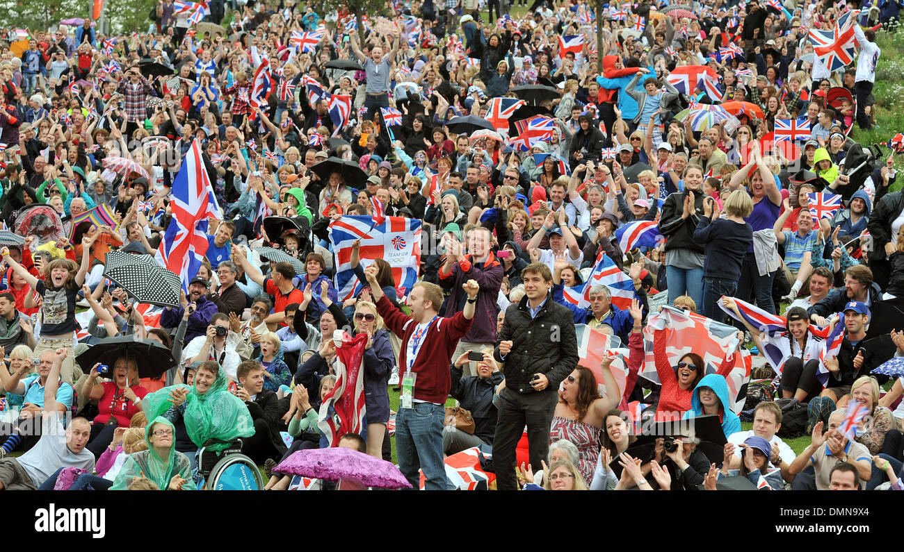 A large group of fans celebrate first Gold Medal won by team GB Rowers ...