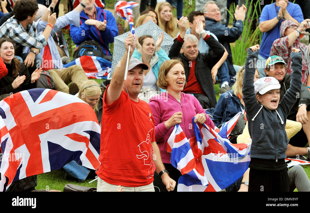 A large group of fans celebrate first Gold Medal won by team GB Rowers ...