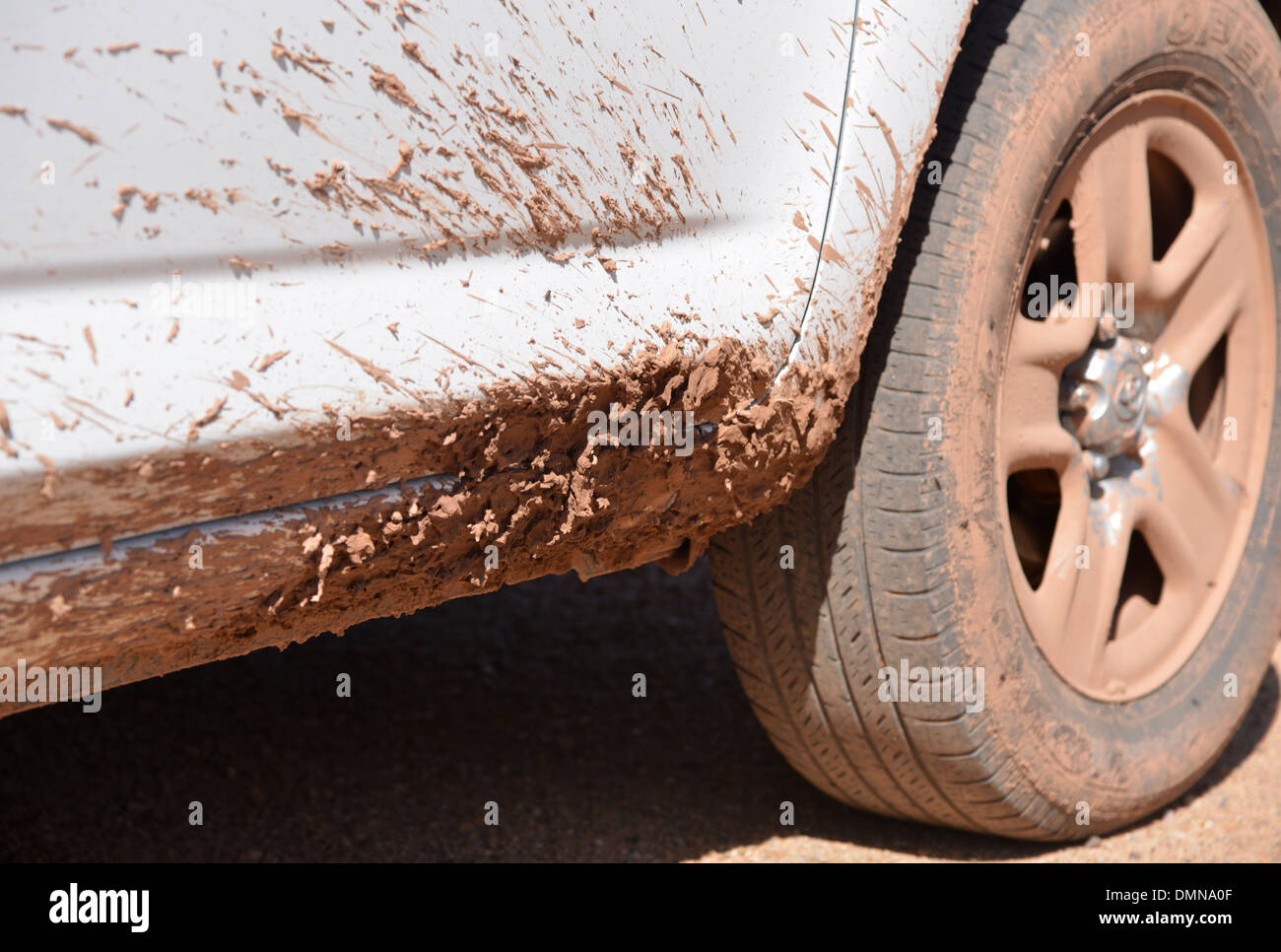 Mud splattered 4x4 wheel and sill Stock Photo - Alamy