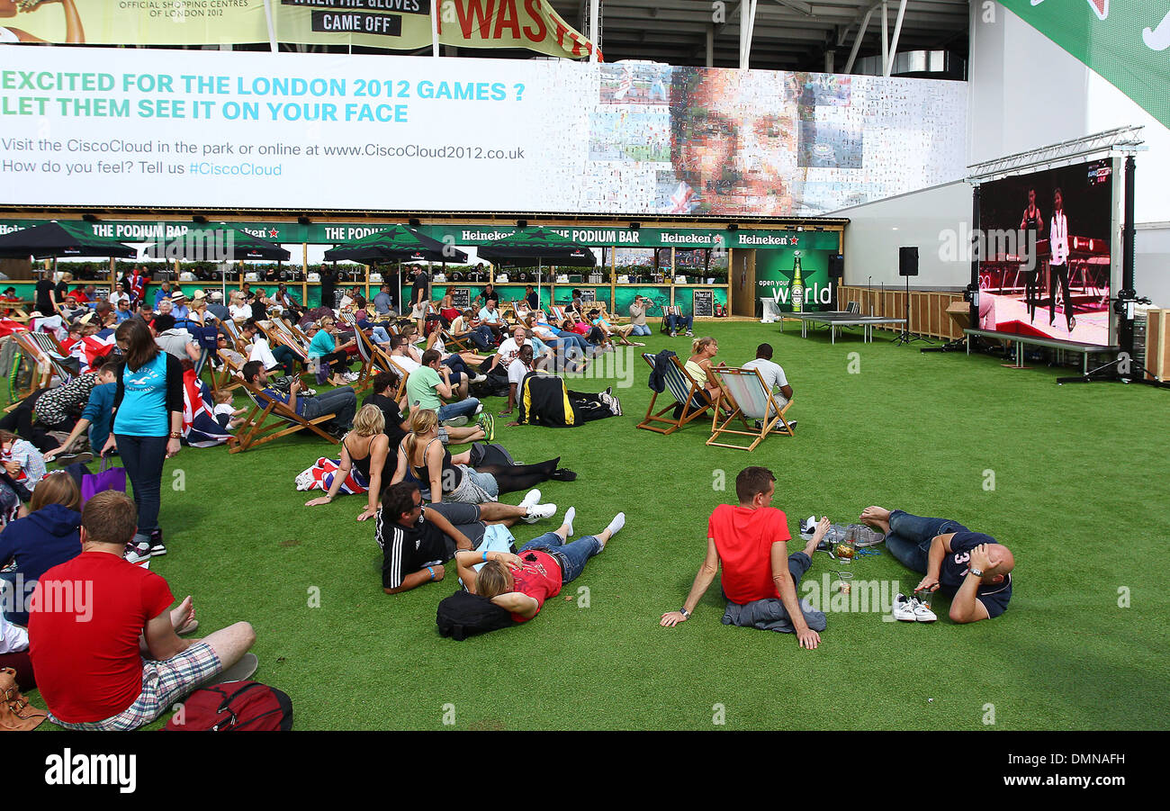 fans watch a big screen during first day of Track and Field at Olympic ...