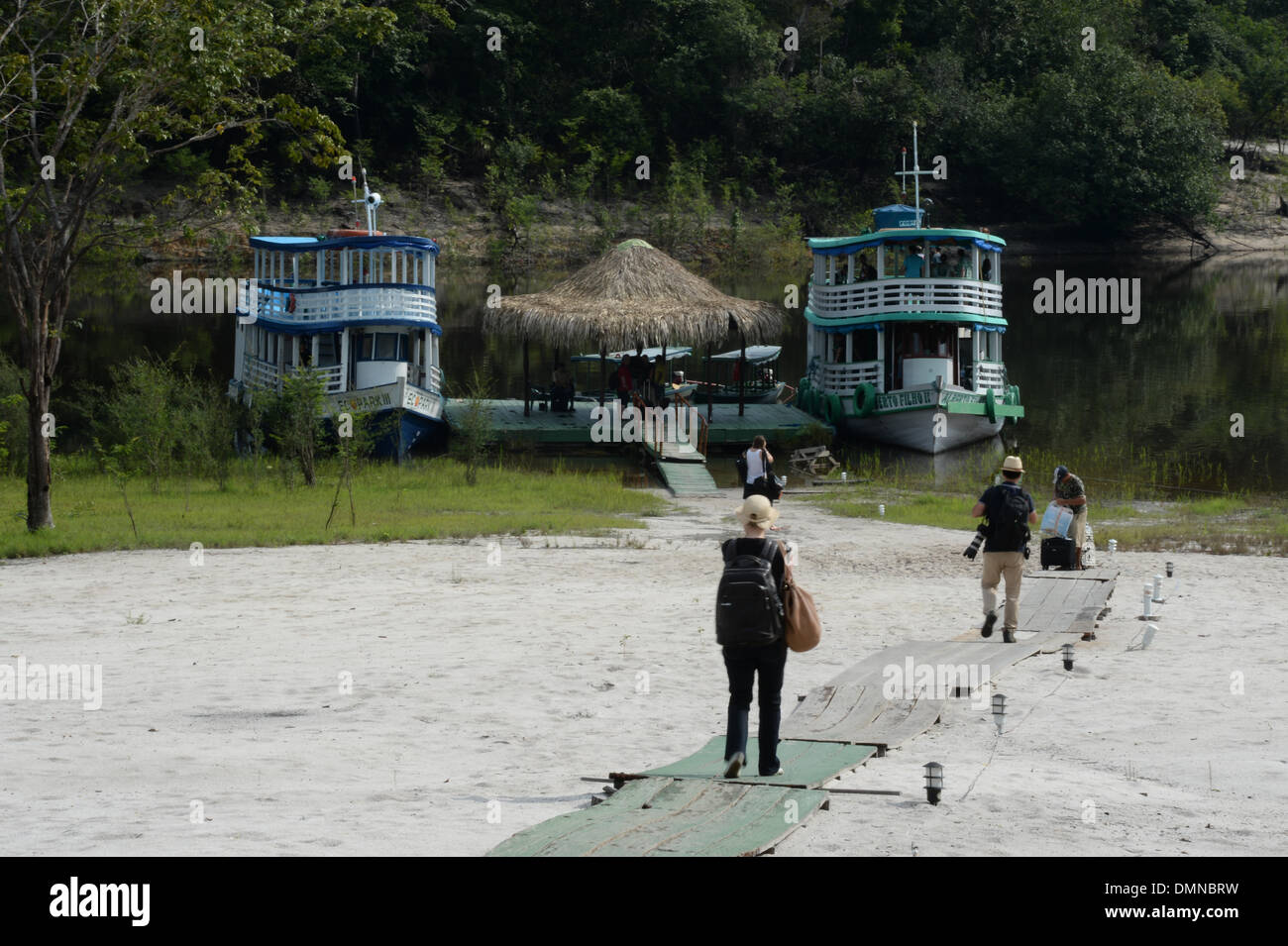 Manaus, Brazil. 12th Dec, 2013. Passengers board a typical Amazon ferry ...