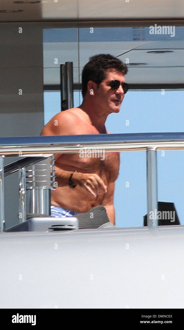 Simon Cowell spends time onboard a luxury yacht during a holiday in St ...
