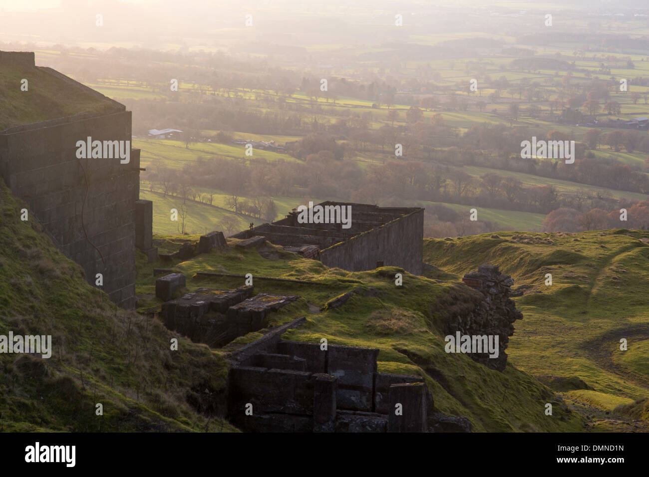 Old concrete quarry buildings in late afternoon light on Titterstone ...