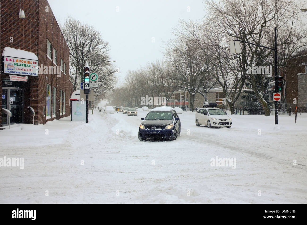 Traffic at a snow covered intersection in Montreal, Quebec Stock Photo ...