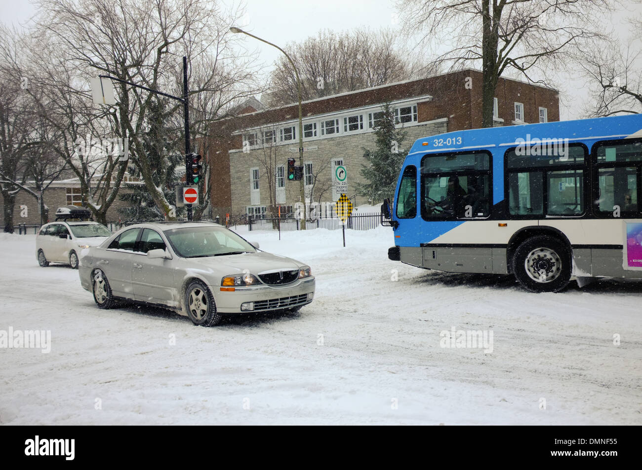 Traffic at a snow covered intersection in Montreal, Quebec Stock Photo ...