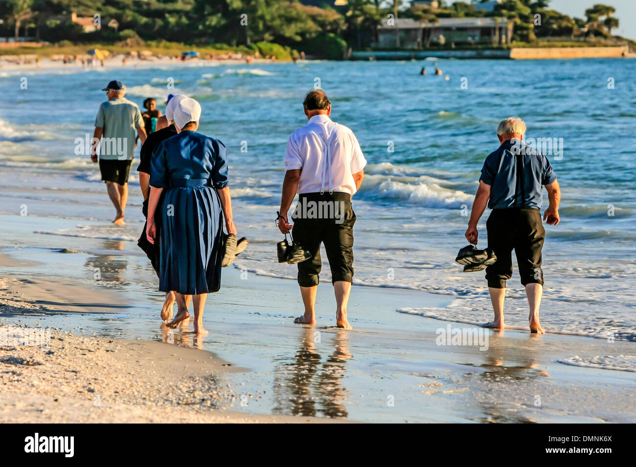 Amish people enjoying walking along the beach at Siesta Key, FL Stock ...