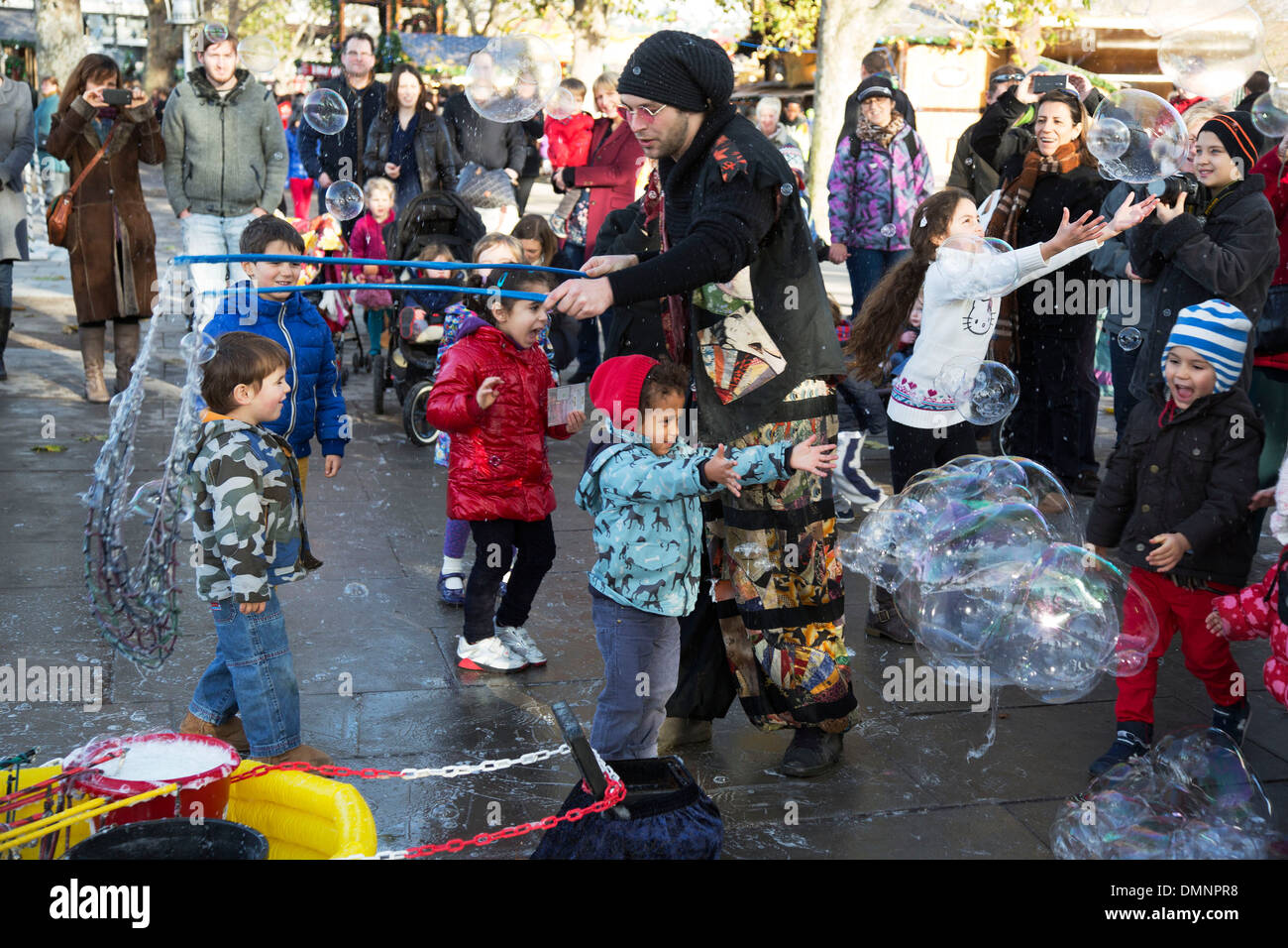 Young student Christmas carol singers performing / busking on the South ...