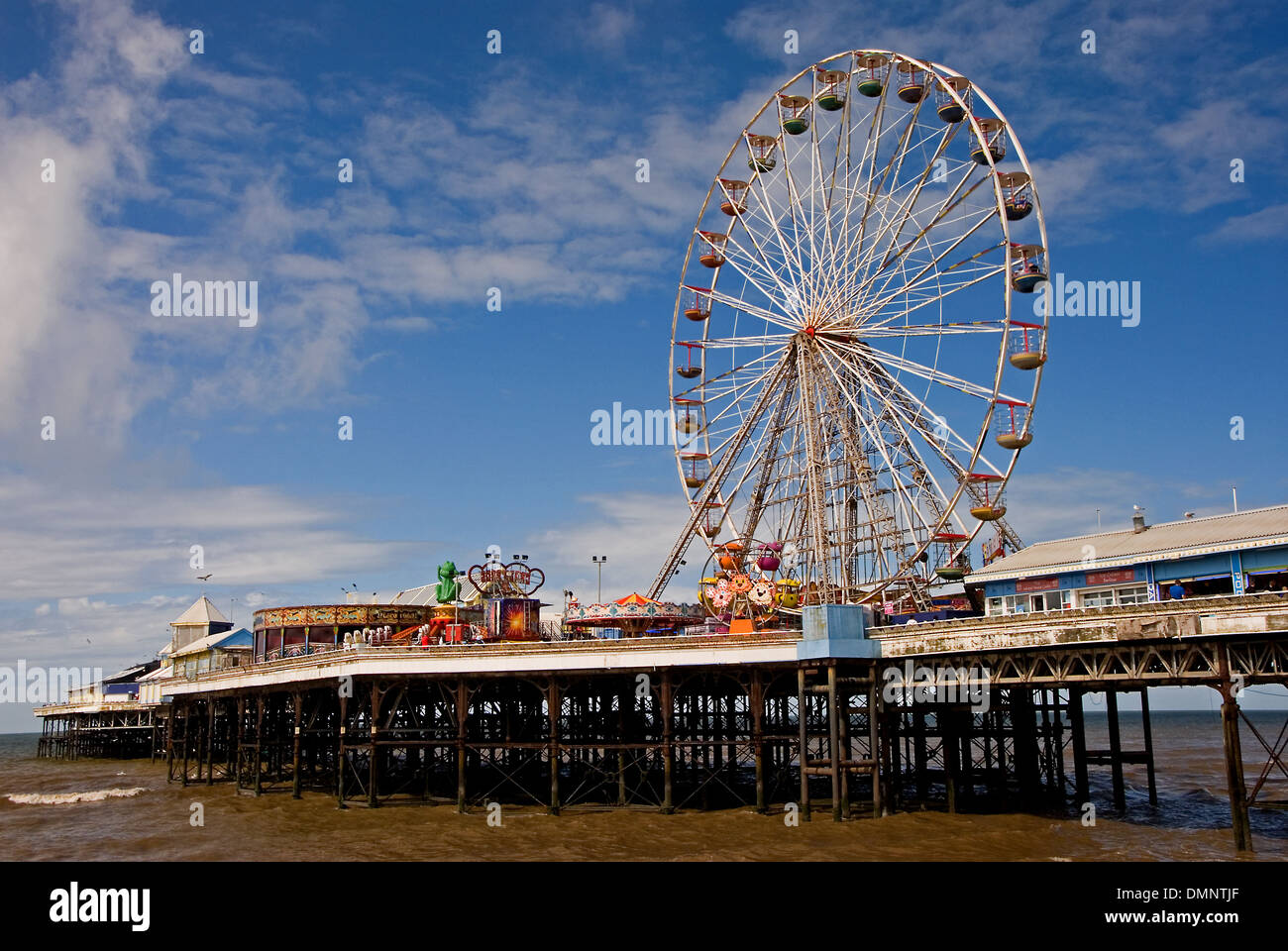 The central pier and ferris wheel on Blackpool sea front are popular ...