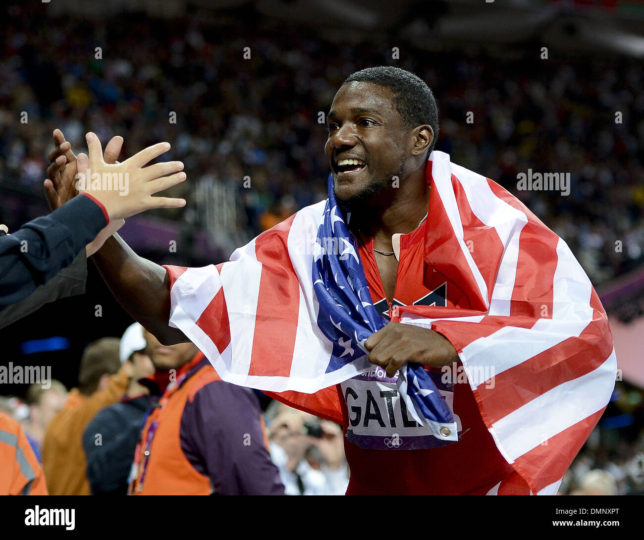Justin Gatlin victorious with American flag after Men's 100M Final at ...