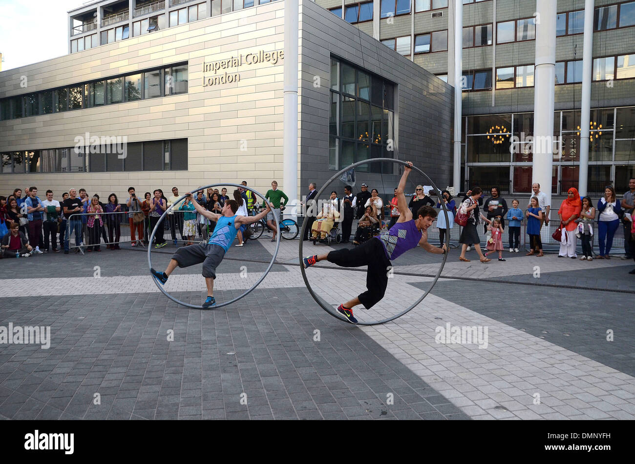 Dance troupe using giant hula hoops display their skill in front of a ...
