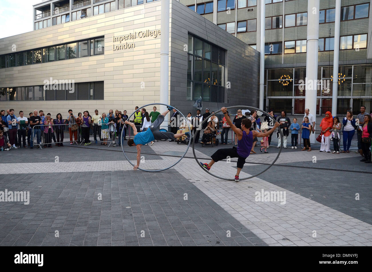 Dance troupe using giant hula hoops display their skill in front of a ...