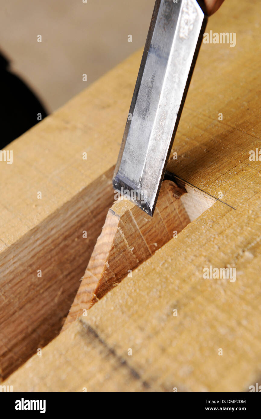 Preparing wood with a chisel Stock Photo - Alamy