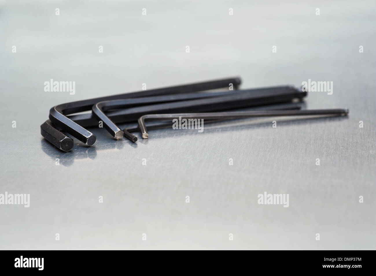 Group of hexagonal wrenches (Allen Keys) on a metal work bench Stock ...