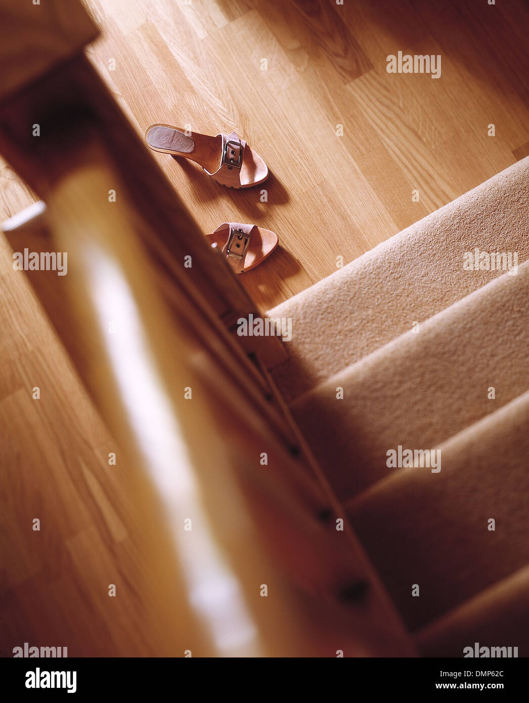 Shoes at the bottom of the stairs Stock Photo - Alamy