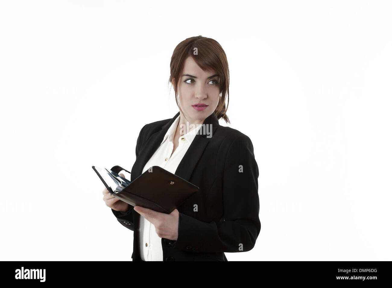 business woman in a sharp suit holding a note book working hard shot in ...