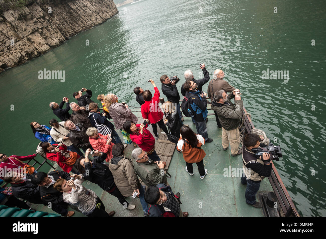 Tourist boat cruising up the Lesser Three Gorges Daning River in China ...