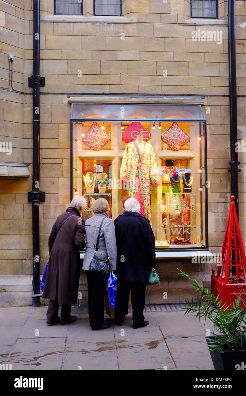Elderly people looking into a shop window Stock Photo - Alamy