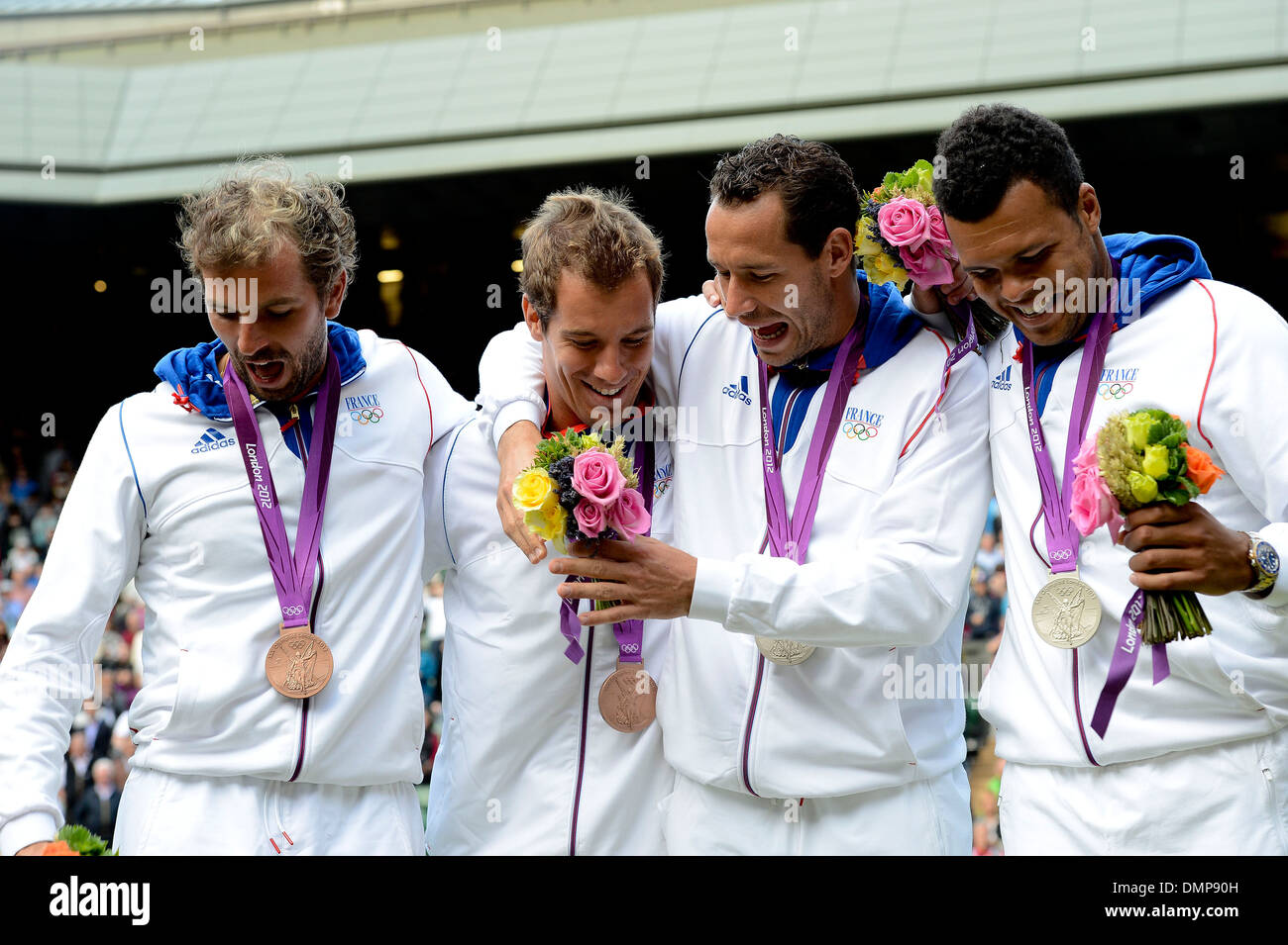 Silver medalist Michael Llodra and Jo-Wilfried Tsonga of Frances and bronze medalist Julien ...