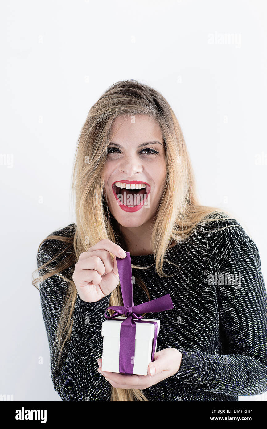 Portrait young woman opening present hi-res stock photography and ...