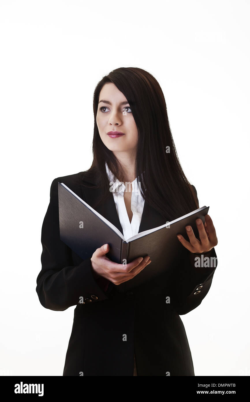 business woman reading from a note book and a light sources is coming ...