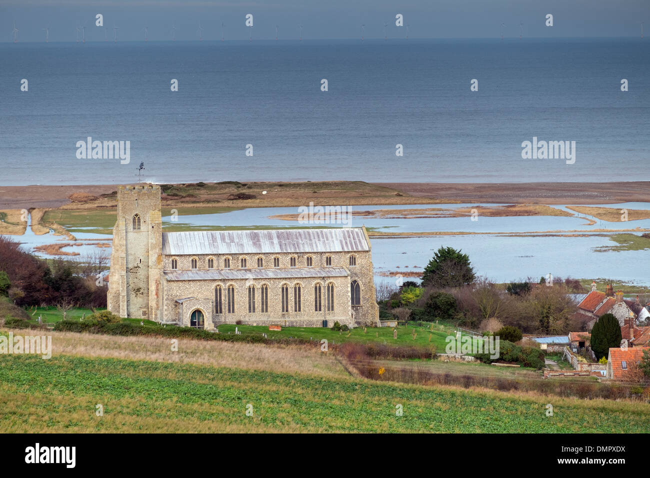 Church of St Nicholas, Salthouse, showing flooded freshmarsh, December ...