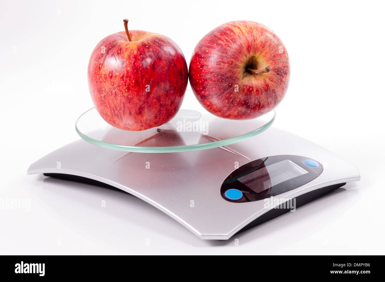 red apple on kitchen scale isolated on white background Stock Photo - Alamy