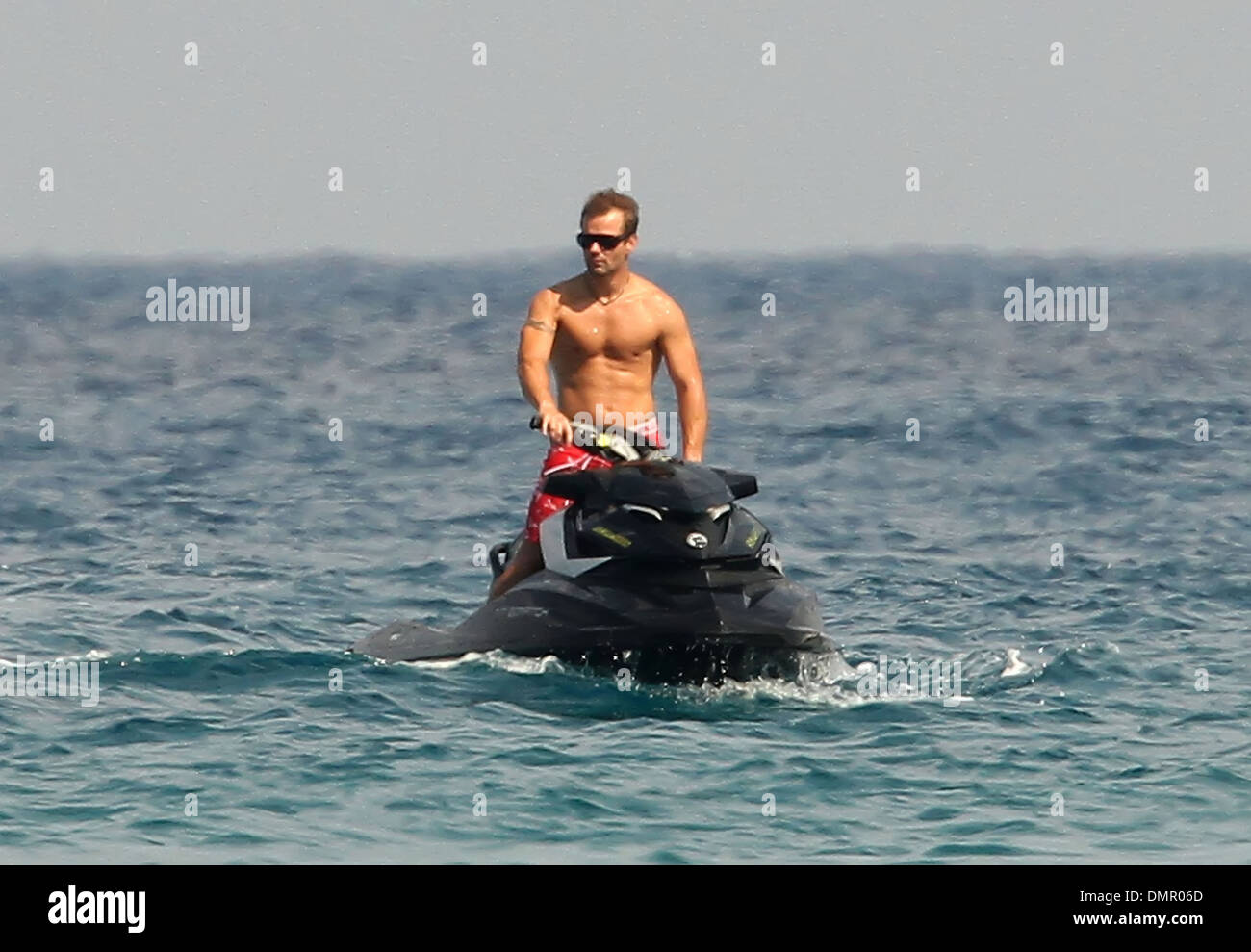 French rally driver Sebastien Loeb rides a jet ski while on holiday in ...