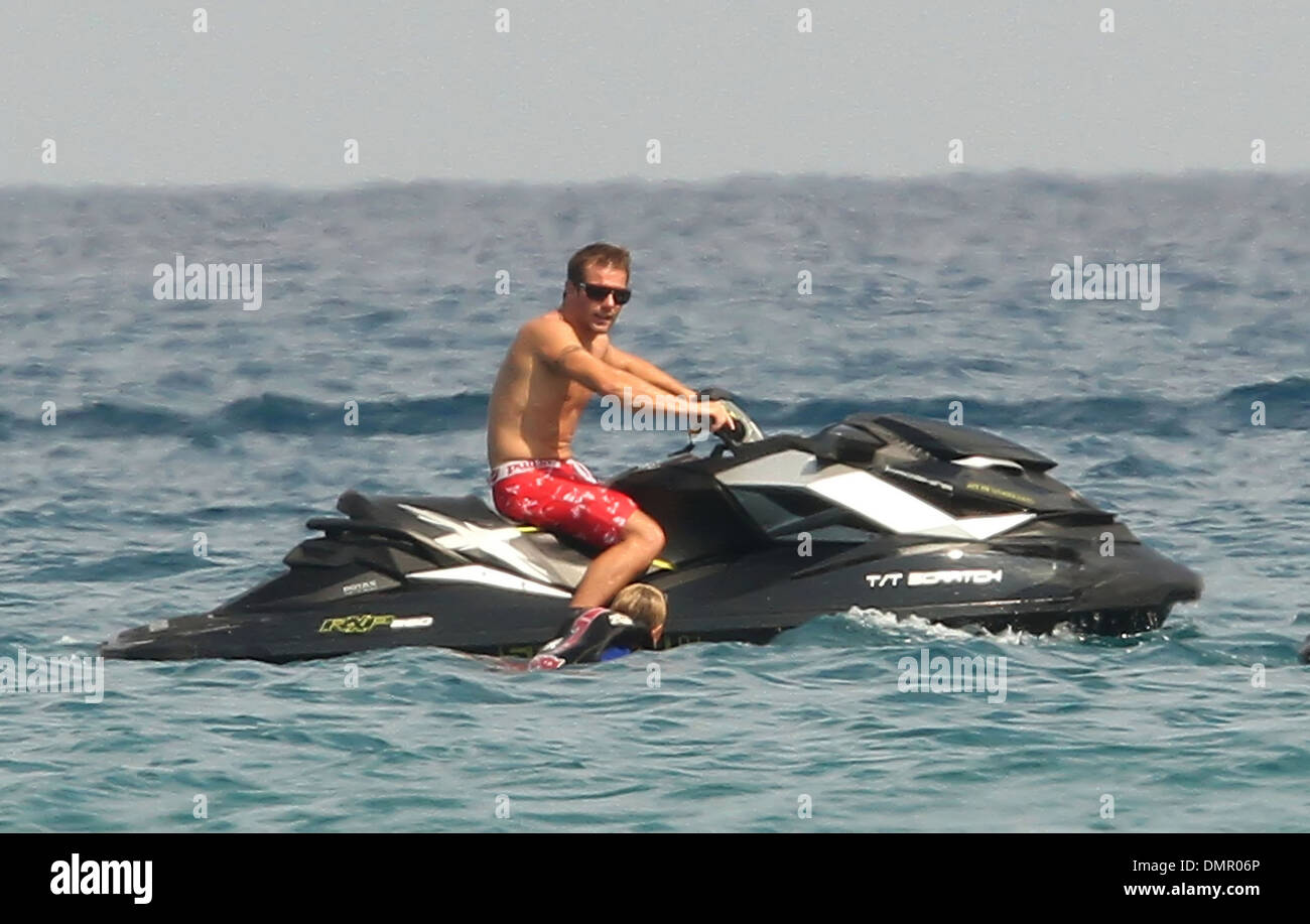 French rally driver Sebastien Loeb rides a jet ski while on holiday in ...
