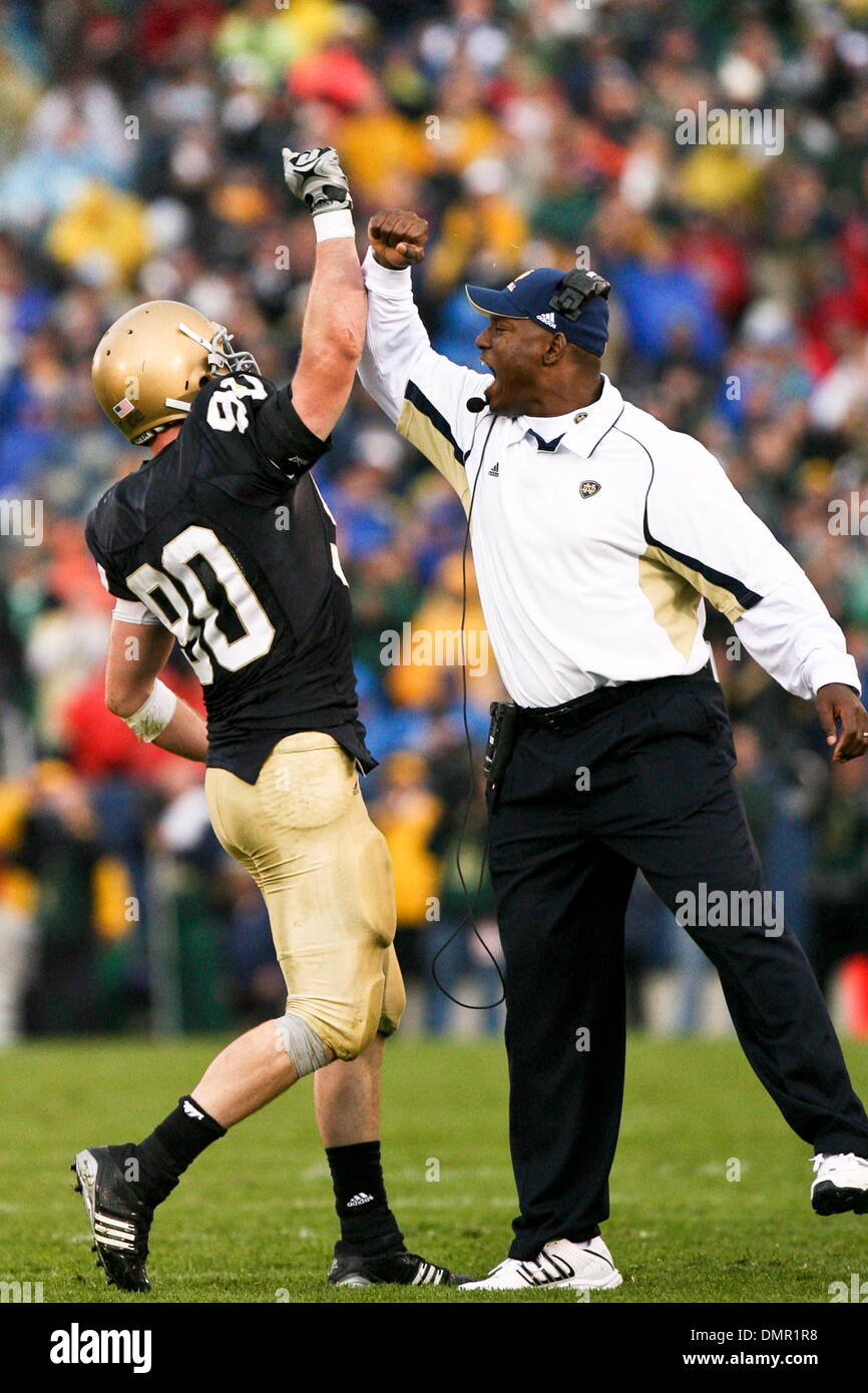 Notre Dame tight end Tyler Effert (80) high-fives one of the assistant ...