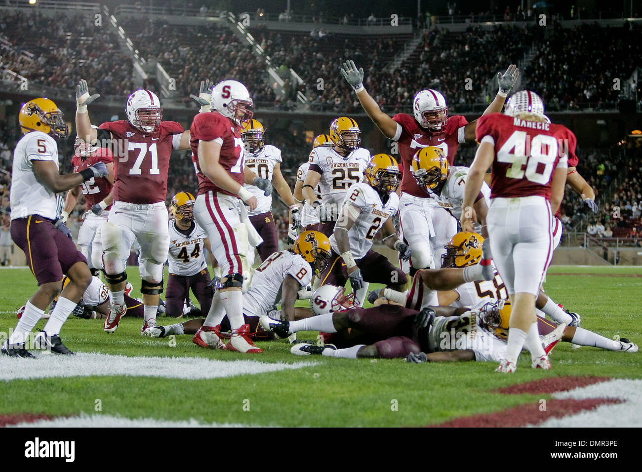 Stanford players signal a touchdown during game action on Saturday at ...